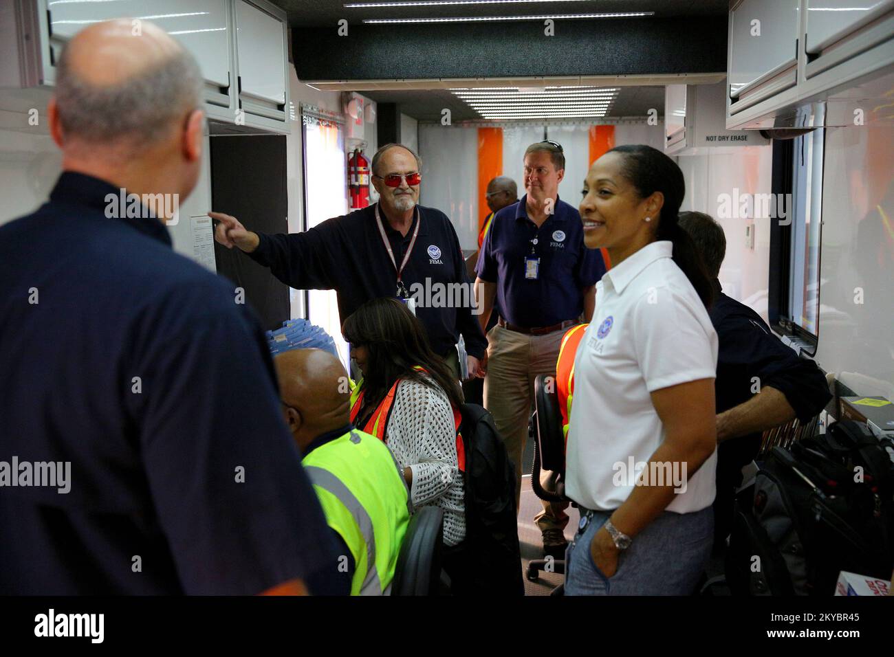 FEMA Logistics Supervisor Mark Ackerman (C) explains to Deputy Regional ...