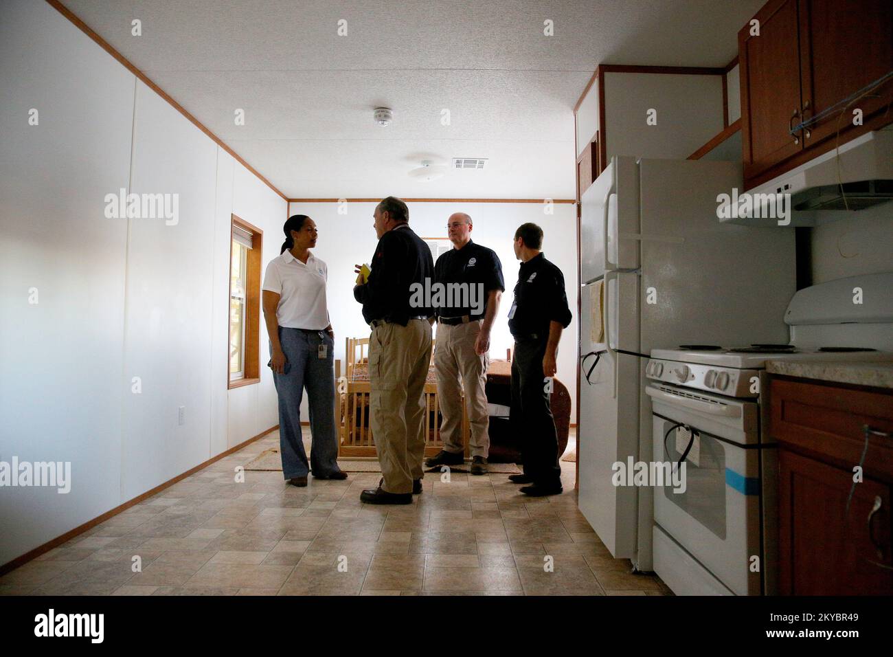 FEMA Logistics Supervisor Mark Ackerman (C) explains to Deputy Regional ...