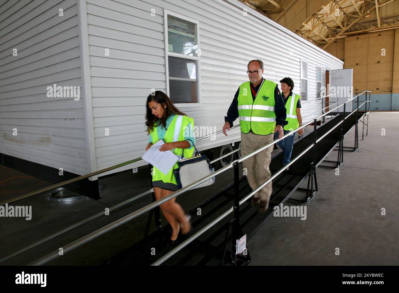 FEMA Logistics Supervisor Mark Ackerman (C) explains the temporary ...