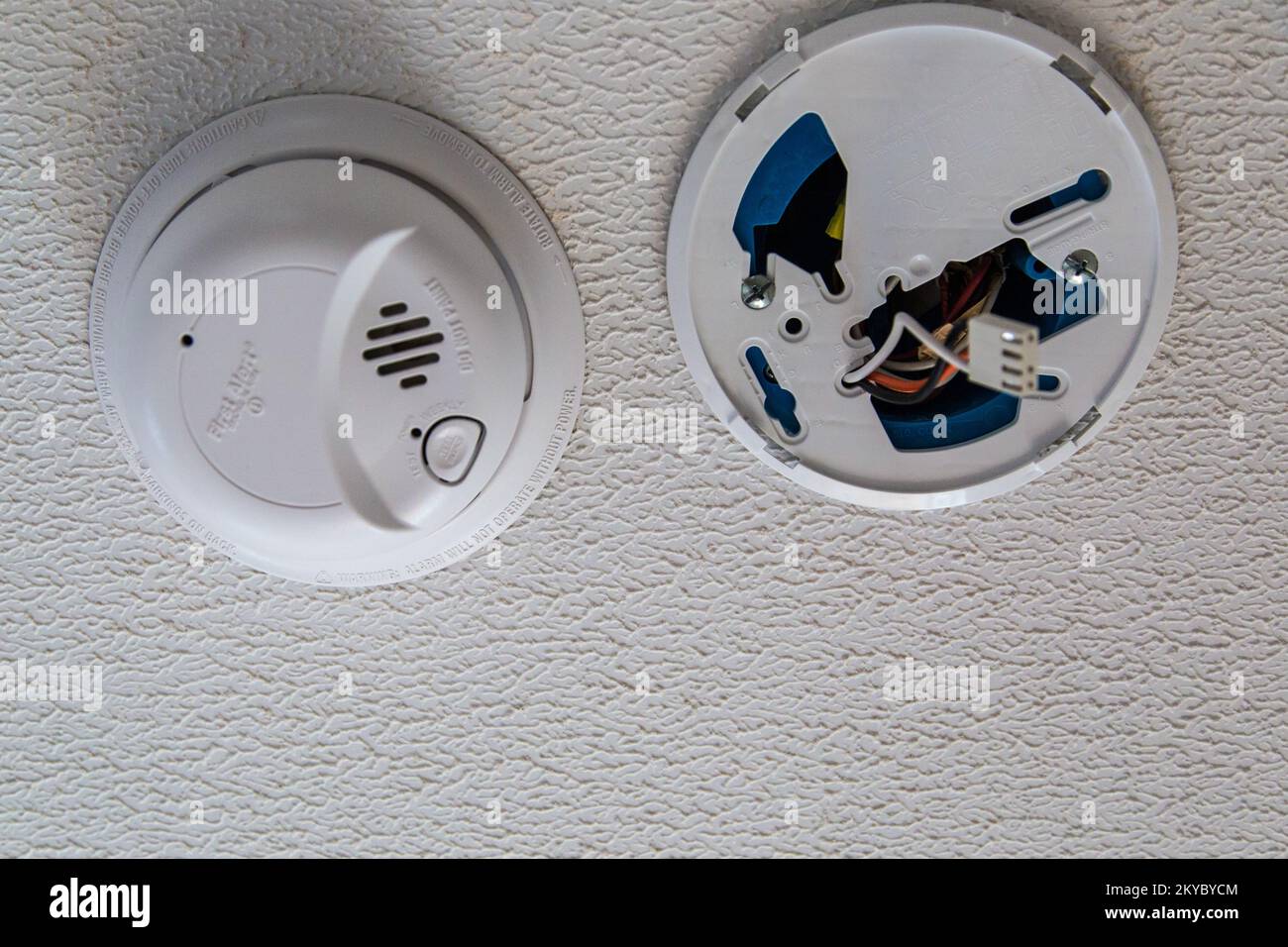 Installed smoke detector (left) and connection for a visual ceiling ...