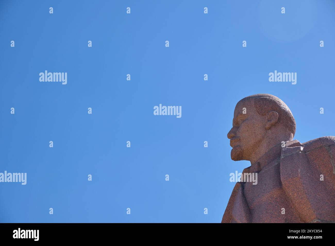 A red granite, stone, marble sculpture, statue of Soviet, Russian ...