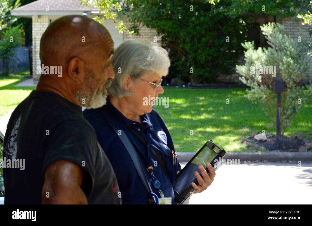 FEMA Disaster Survivor Assistance worker, Patricia Klebenow, talks with ...