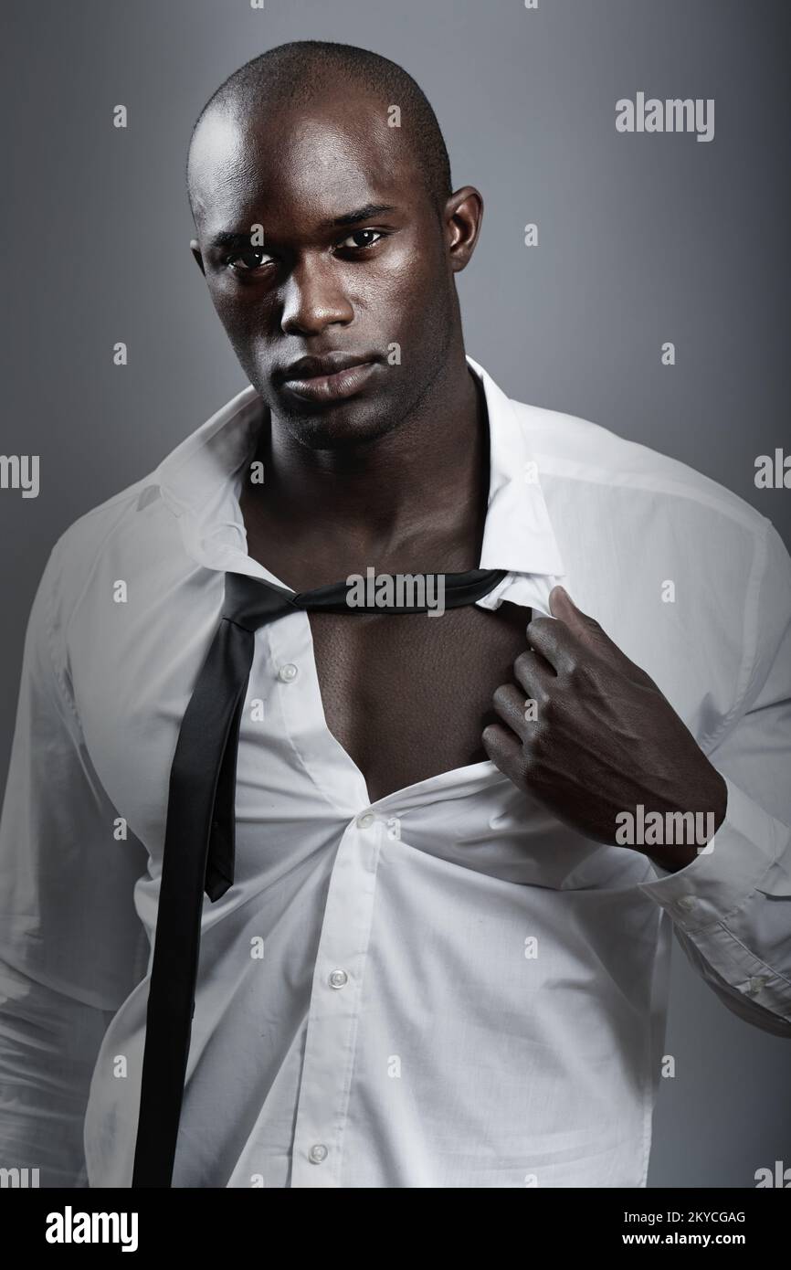 Masculine confidence. A handsome african man modeling clothes in studio ...