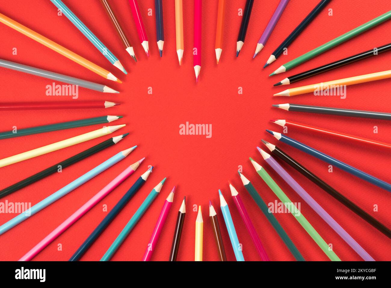 Composition of colorful pencils forming heart shape by slate pencils on ...