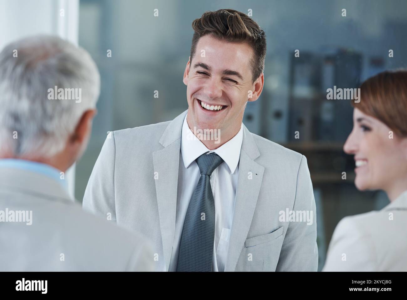 He has the charisma to charm his companys business clients. smiling ...