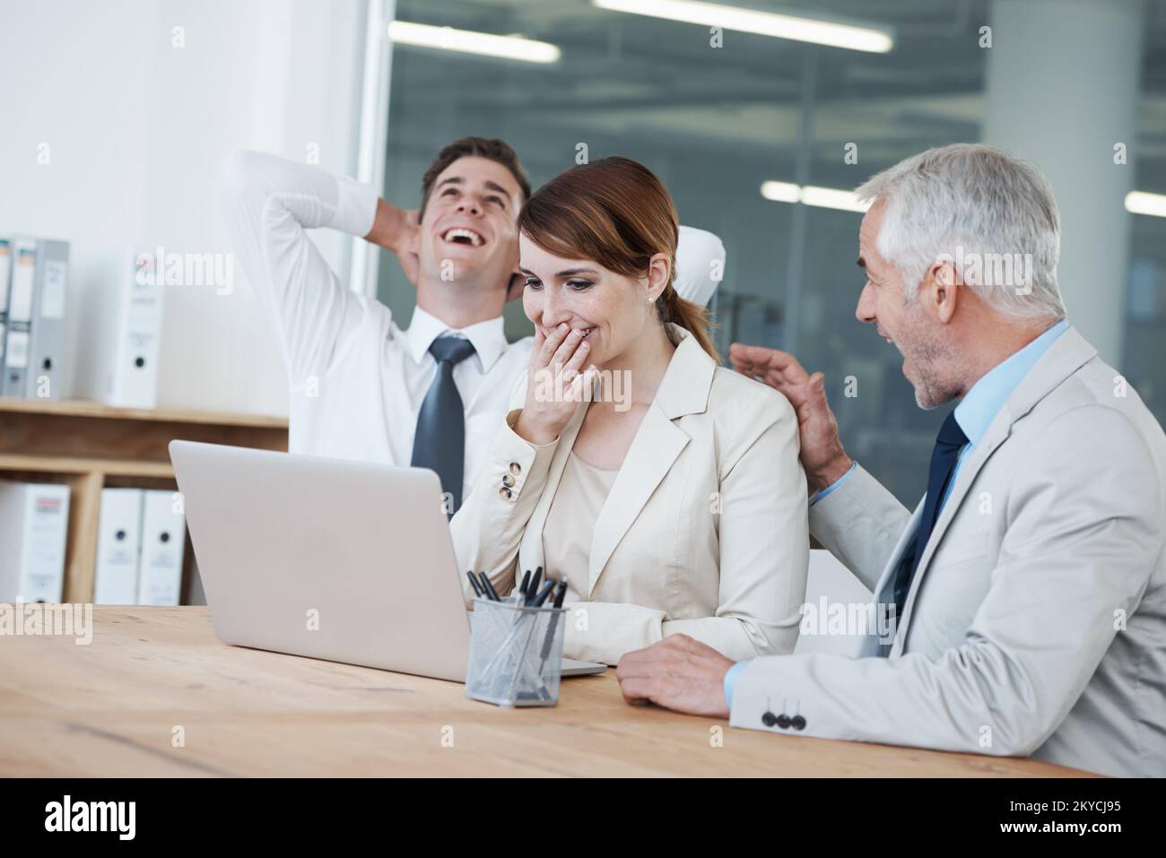 The weekly board room meeting has started. a group of colleagues having ...