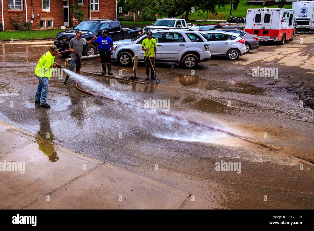 Cleaning the Mud from Streets. West Virginia Severe Storms, Flooding ...
