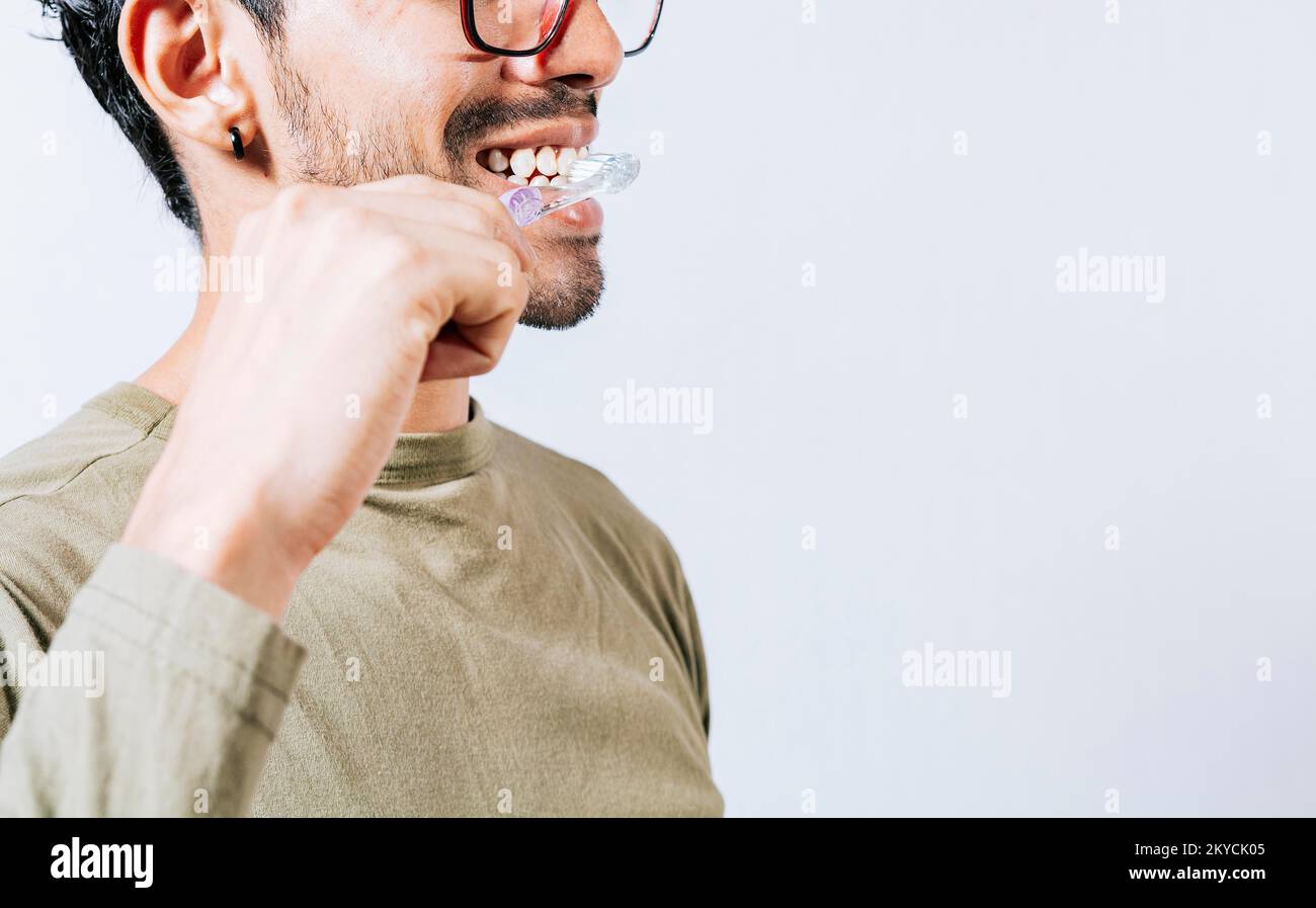 Face of person brushing teeth isolated with copy space. Man brushing ...