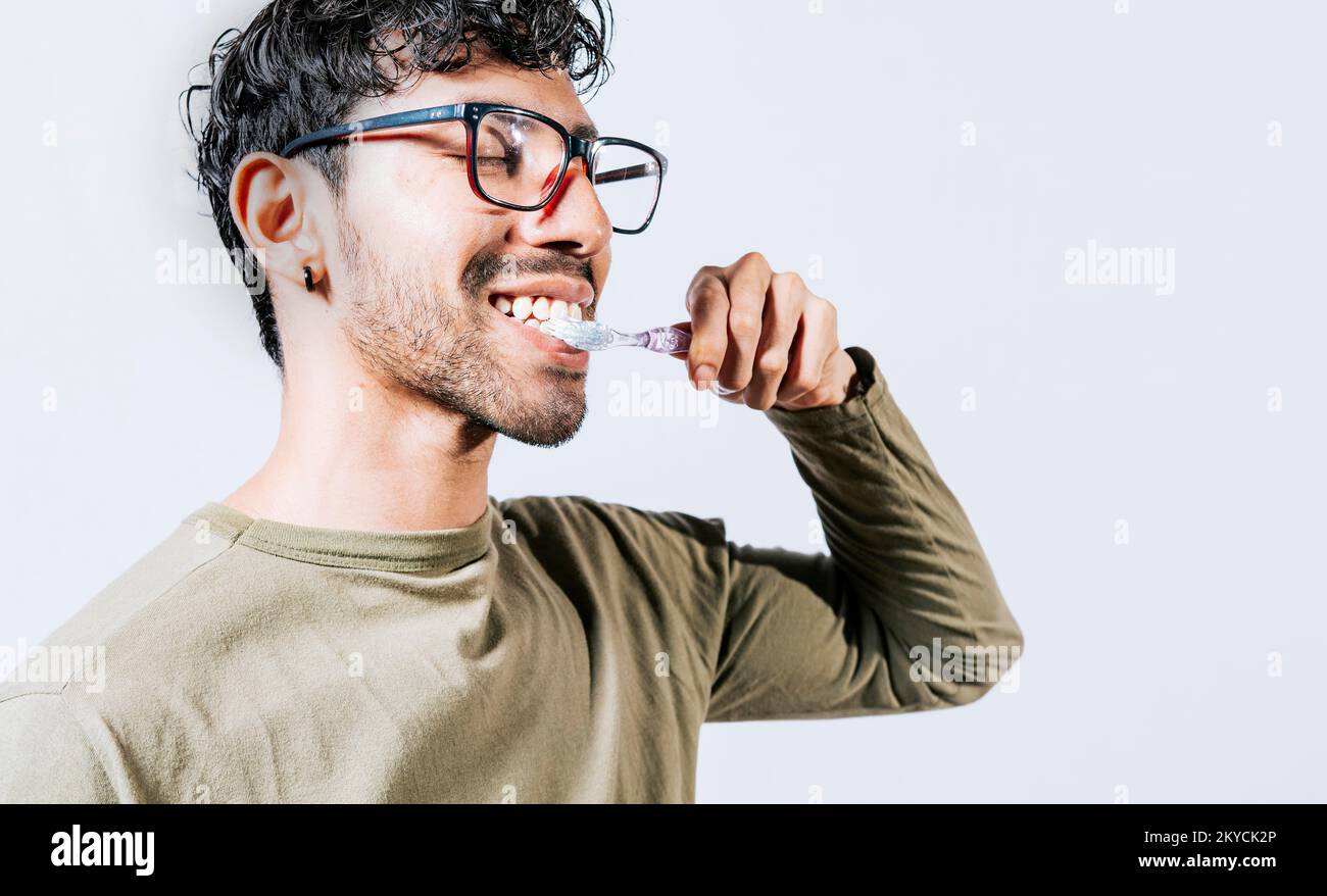 Man brushing his teeth isolated, Face of handsome man brushing his ...