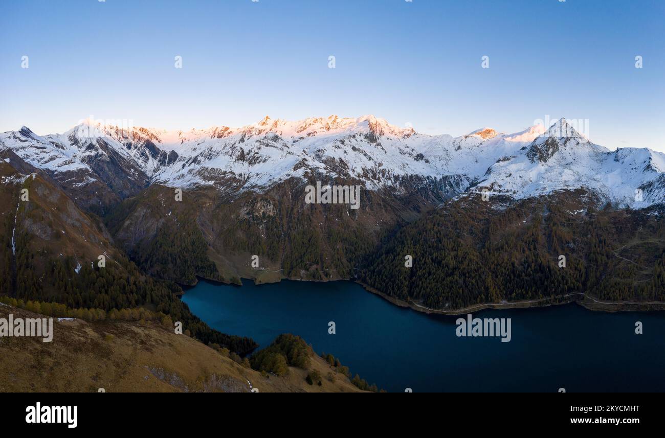 Aerial view over Lago di Luzzone with the first sunlight on the ...