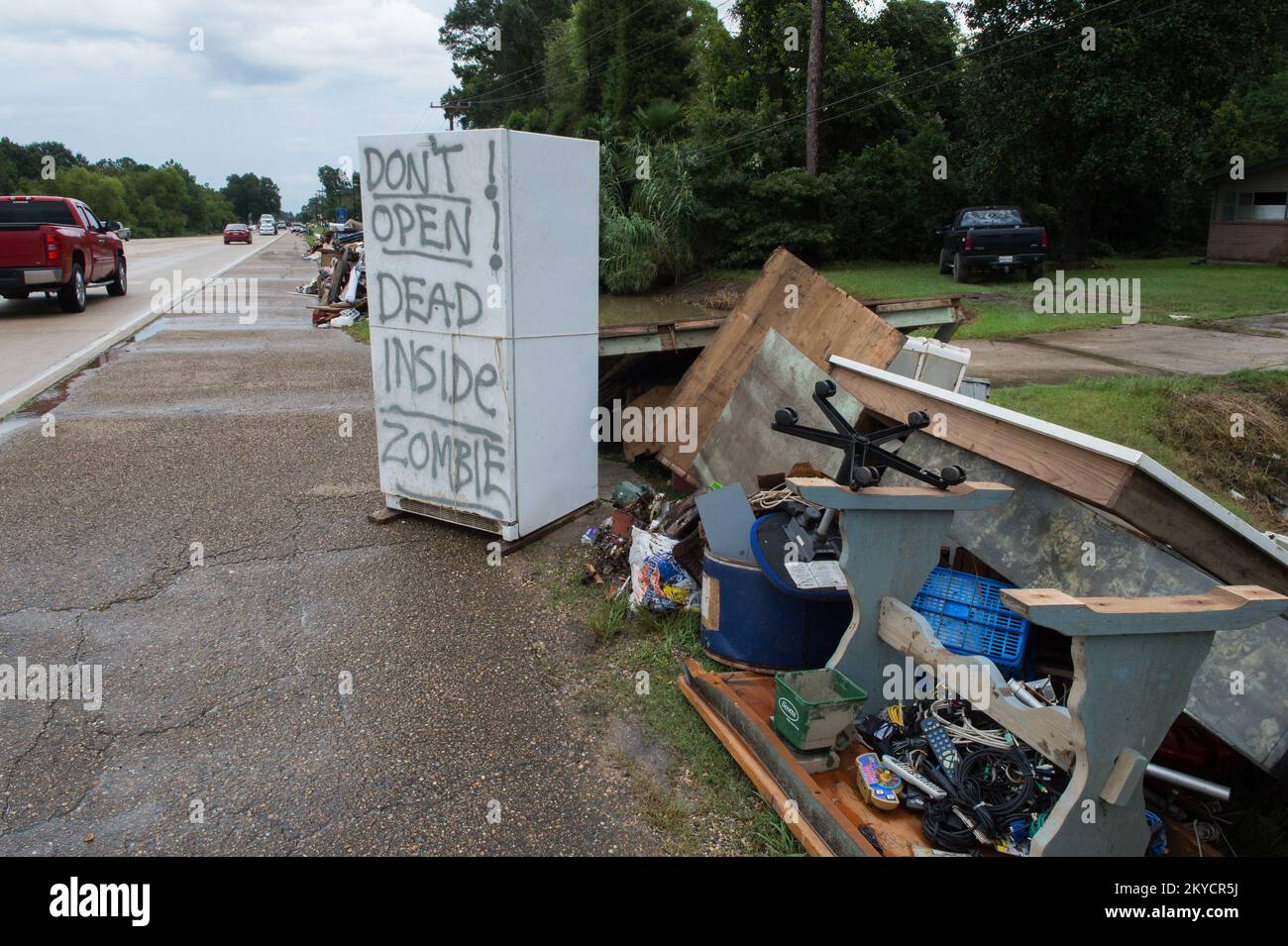 Piles of debris line the side of the roads in flood affected areas one ...
