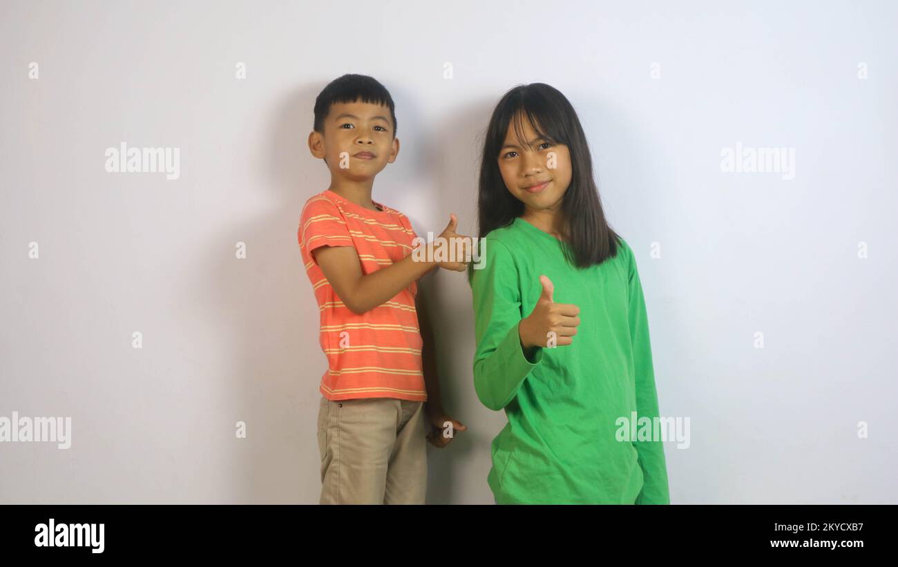 cute brothers and sisters isolated white background Stock Photo - Alamy