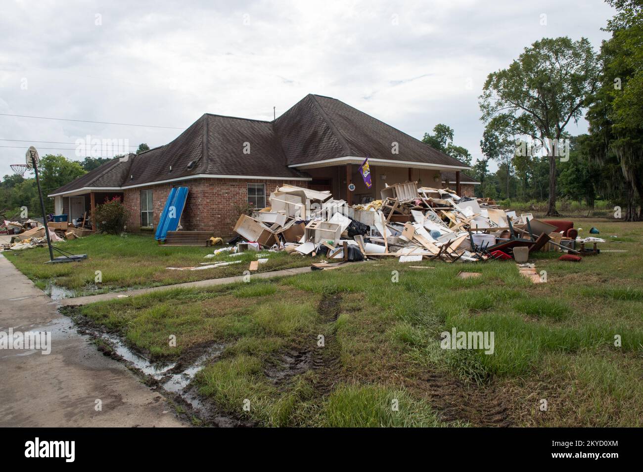 Debris pile outside of flood damaged home in Acy, La.. Louisiana Severe ...