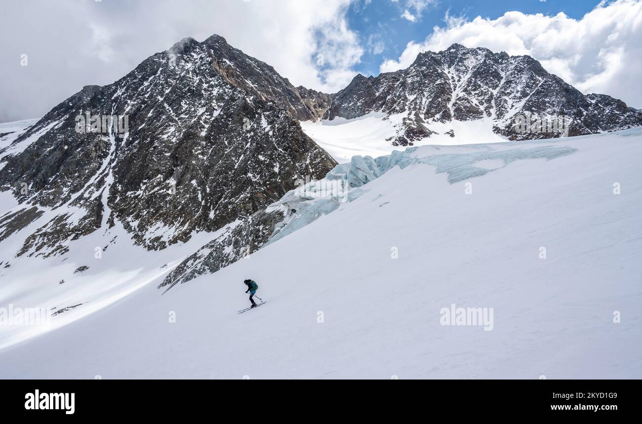Ski tourers on the descent at Alpeiner Ferner, mountains in winter ...