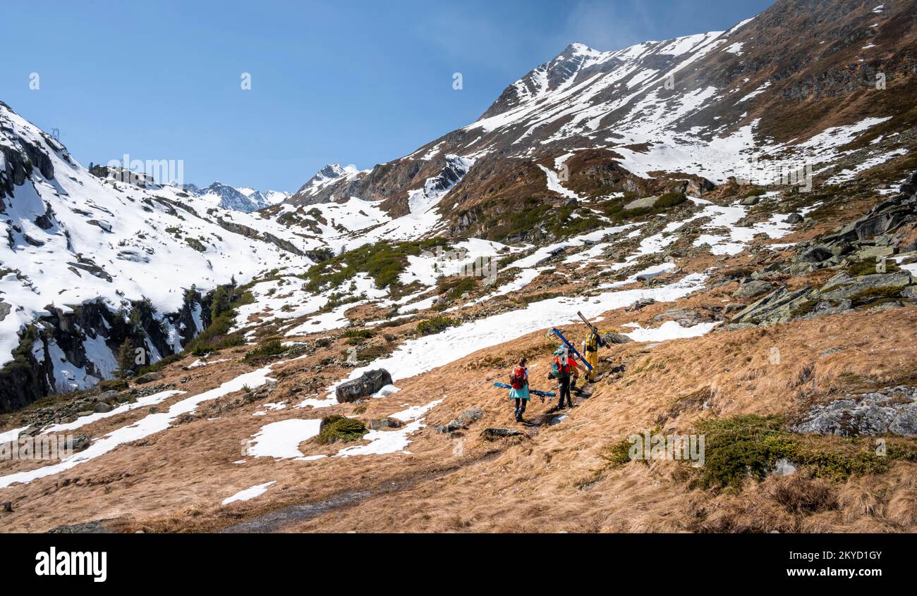 Ski tourers hiking in spring with little snow, Neustift im Stubai ...