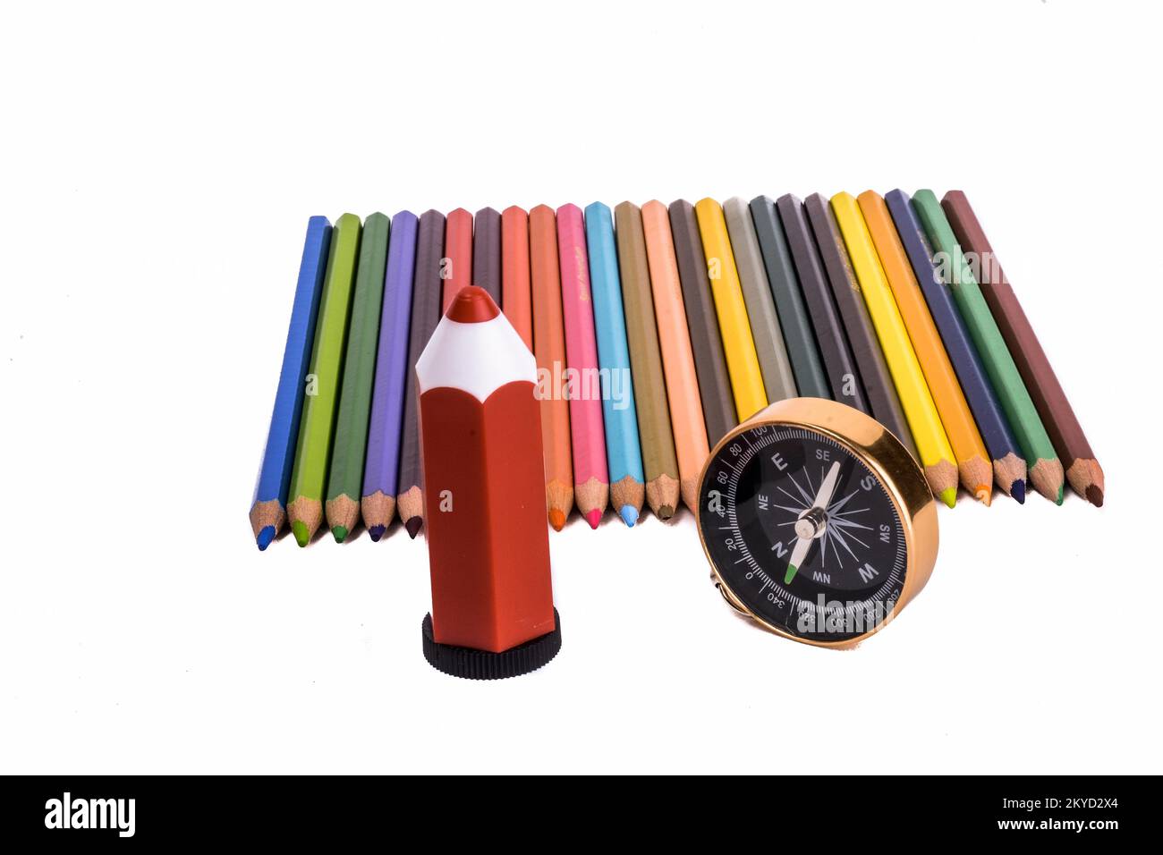 Colour pencil with compass and pen on white background Stock Photo - Alamy