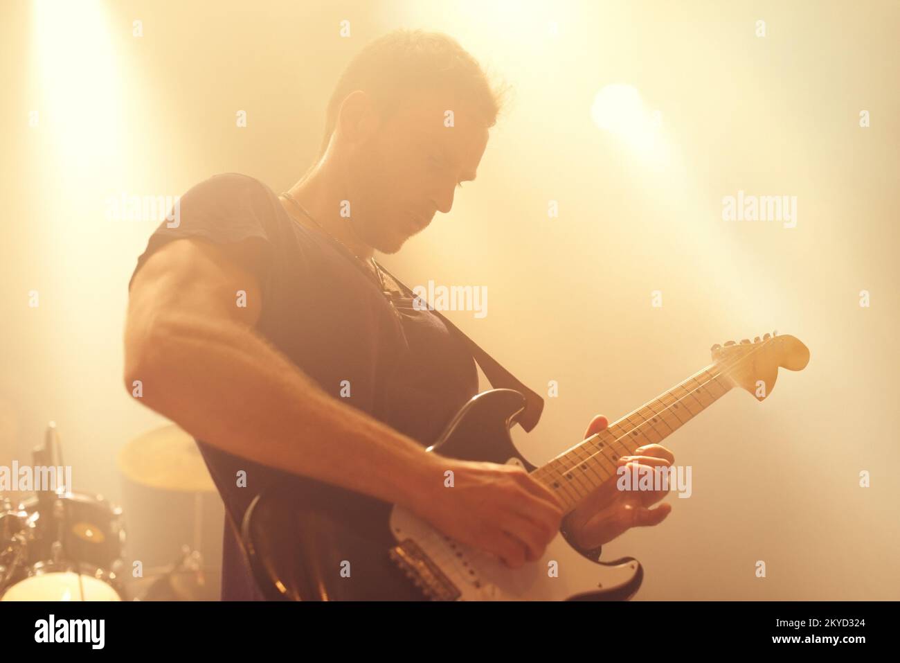 What a great solo. A guitarist performing on stage at a concert Stock ...