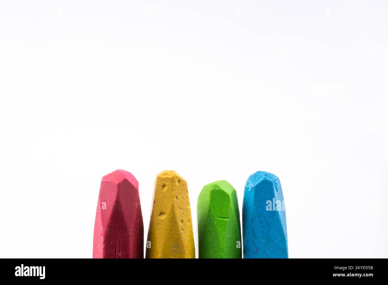 Colorful crayons side by side on a white background Stock Photo - Alamy