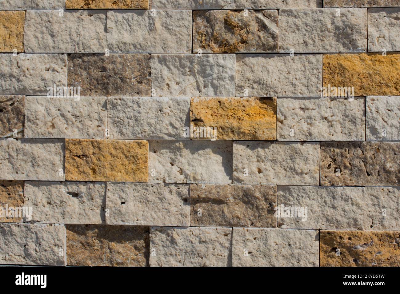 Decorative cubic stone wall as background texture Stock Photo - Alamy