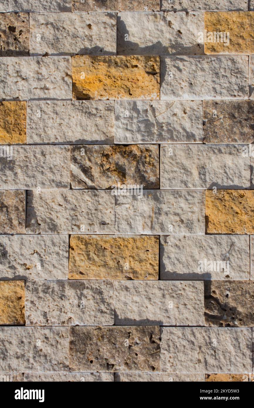 Decorative cubic stone wall as background texture Stock Photo - Alamy