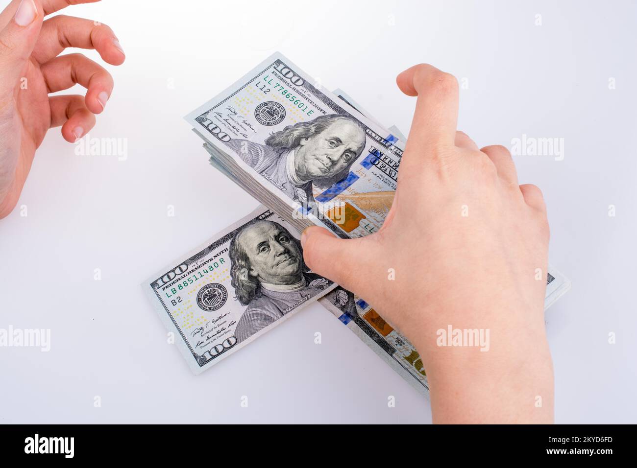 Human hand holding American dollar bill as money isolated on white ...