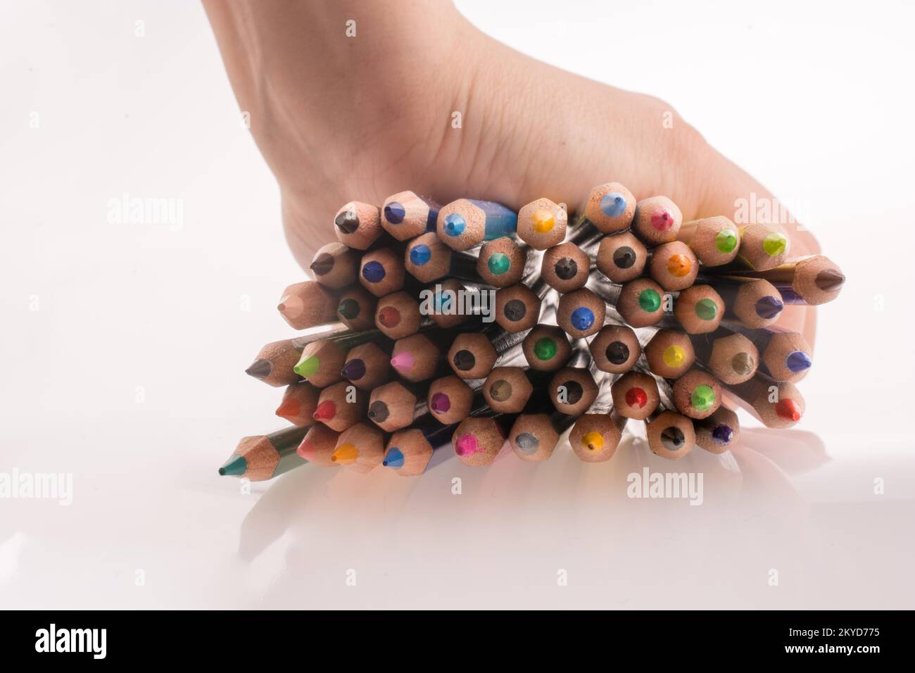 Hand holding Color pencils on a white background Stock Photo - Alamy