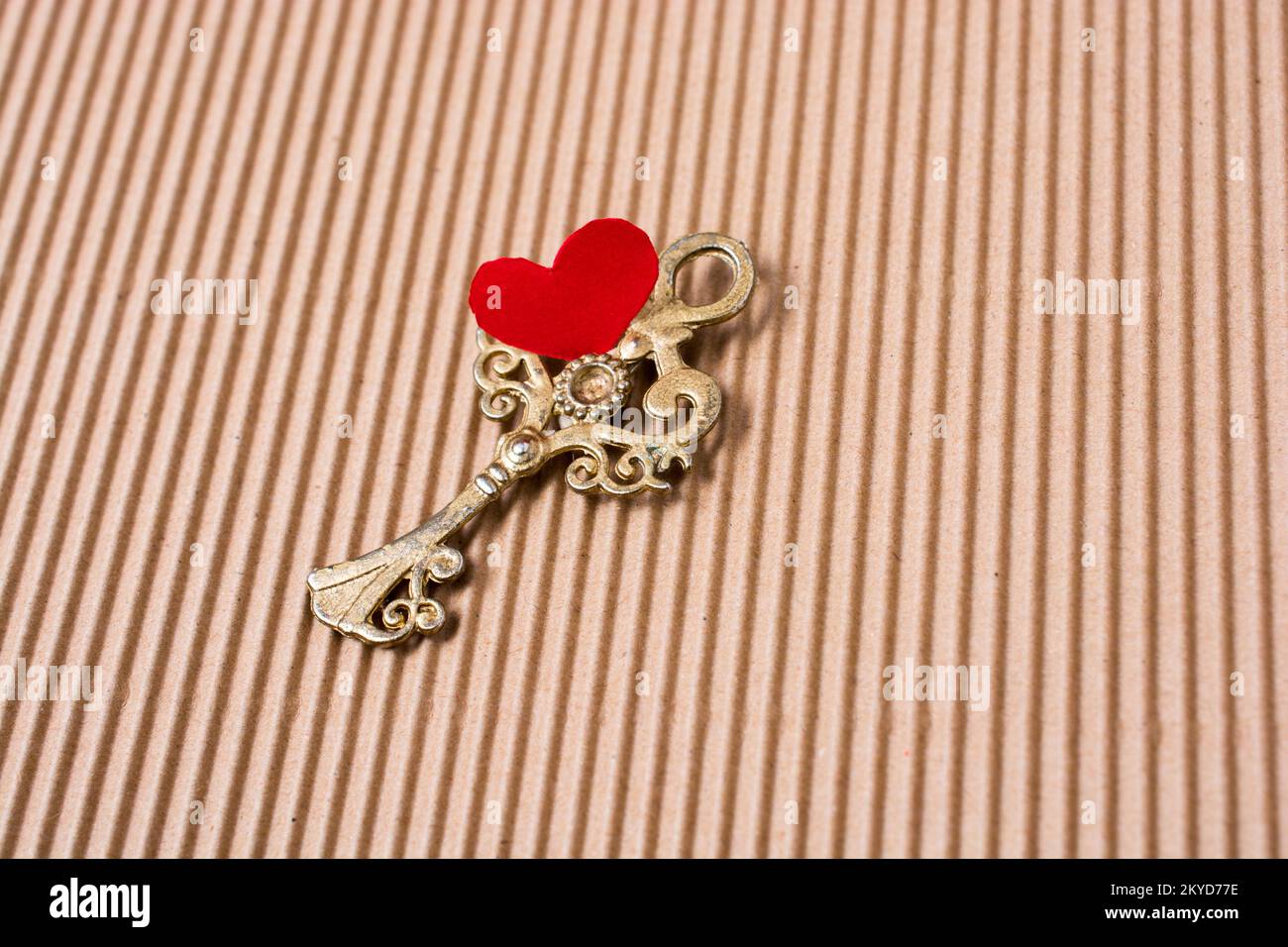 Retro styled decorative key and paper heart shape Stock Photo - Alamy