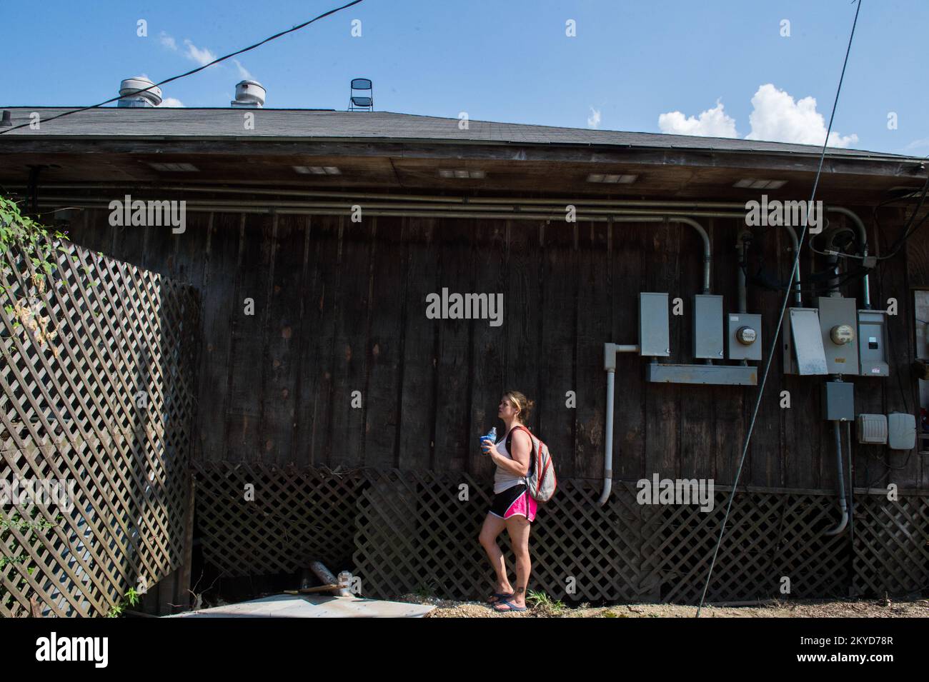 Jasmin Cedotal stands under the flood waterline left on the Bayview ...