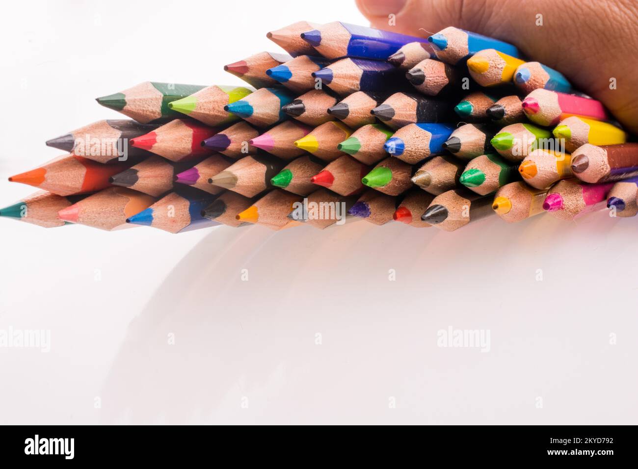 Hand holding Color pencils on a white background Stock Photo - Alamy