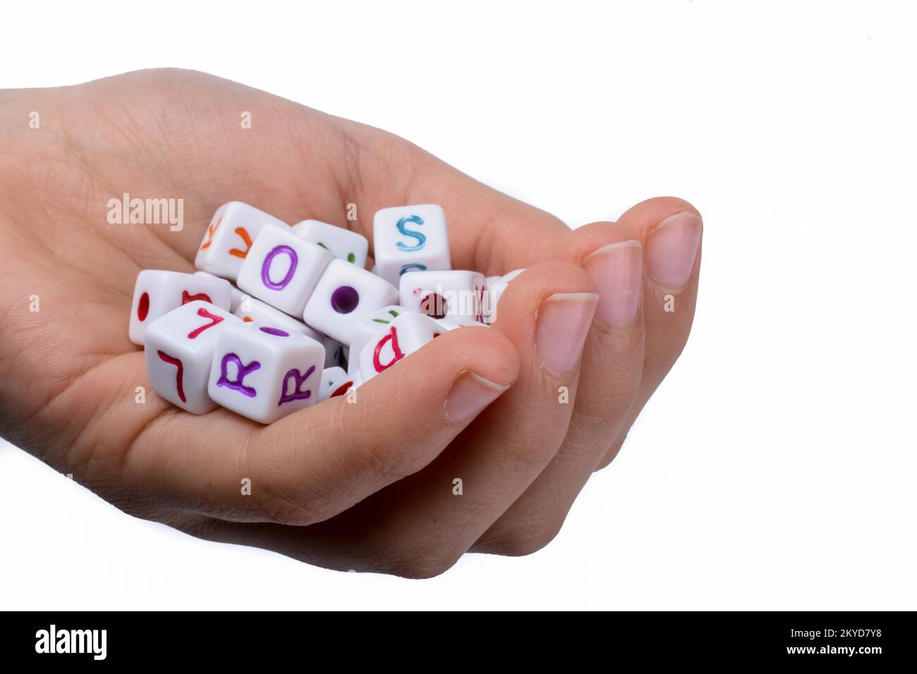 Hand holding colorful alphabet letters as cubes on white background ...