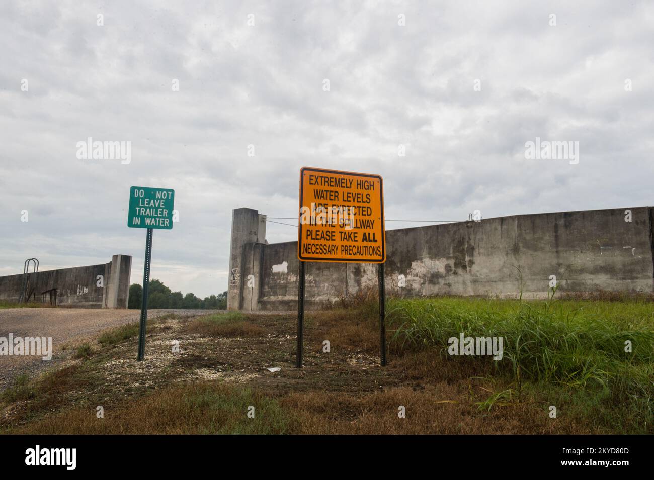 Sign warning of high water levels posted outside the levee wall ...