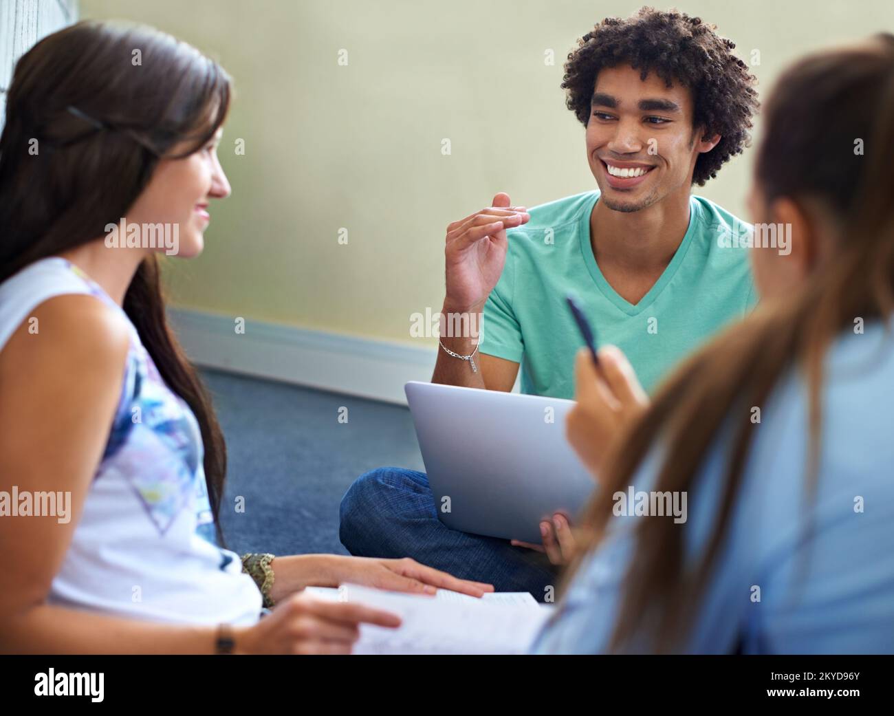 Sharing his ideas for their research project. Cropped view of college ...
