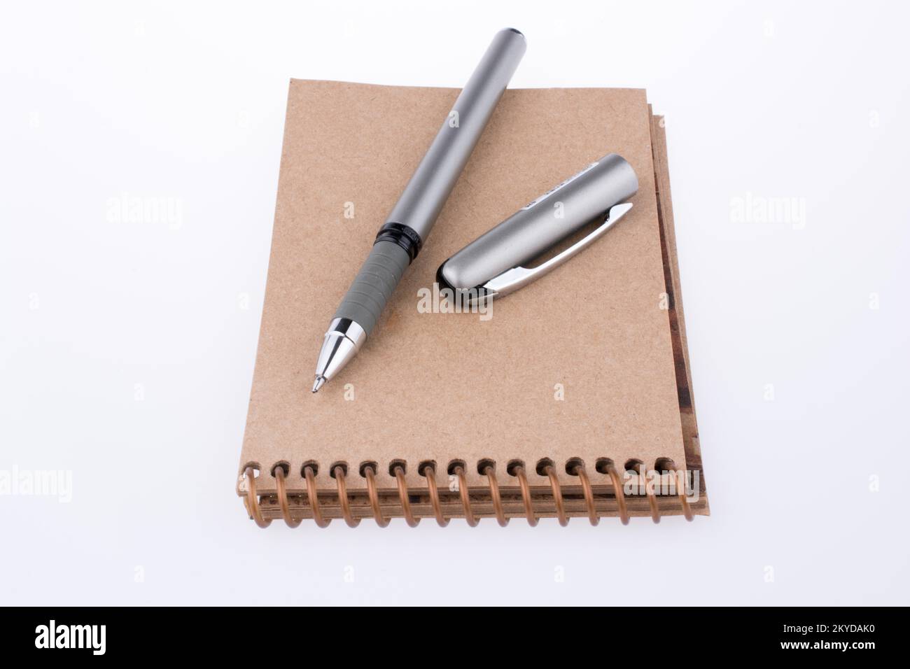 Pen on a spiral notebook Stock Photo - Alamy