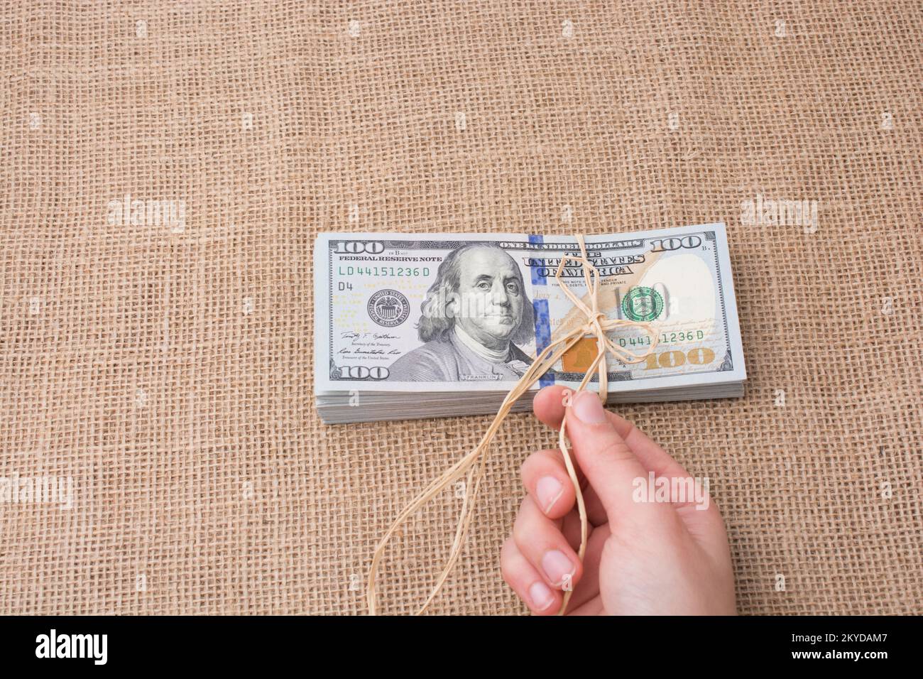 Banknote bundle of US dollar tied with colorful a ribbon Stock Photo ...