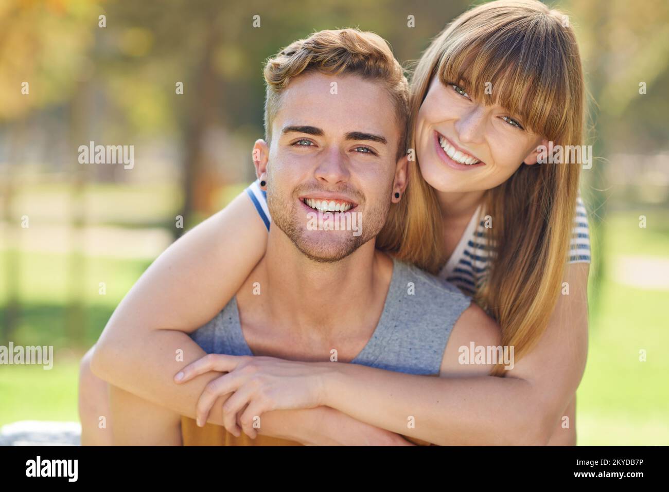 Smitten with new love. a young couple enjoying a day together in a park ...
