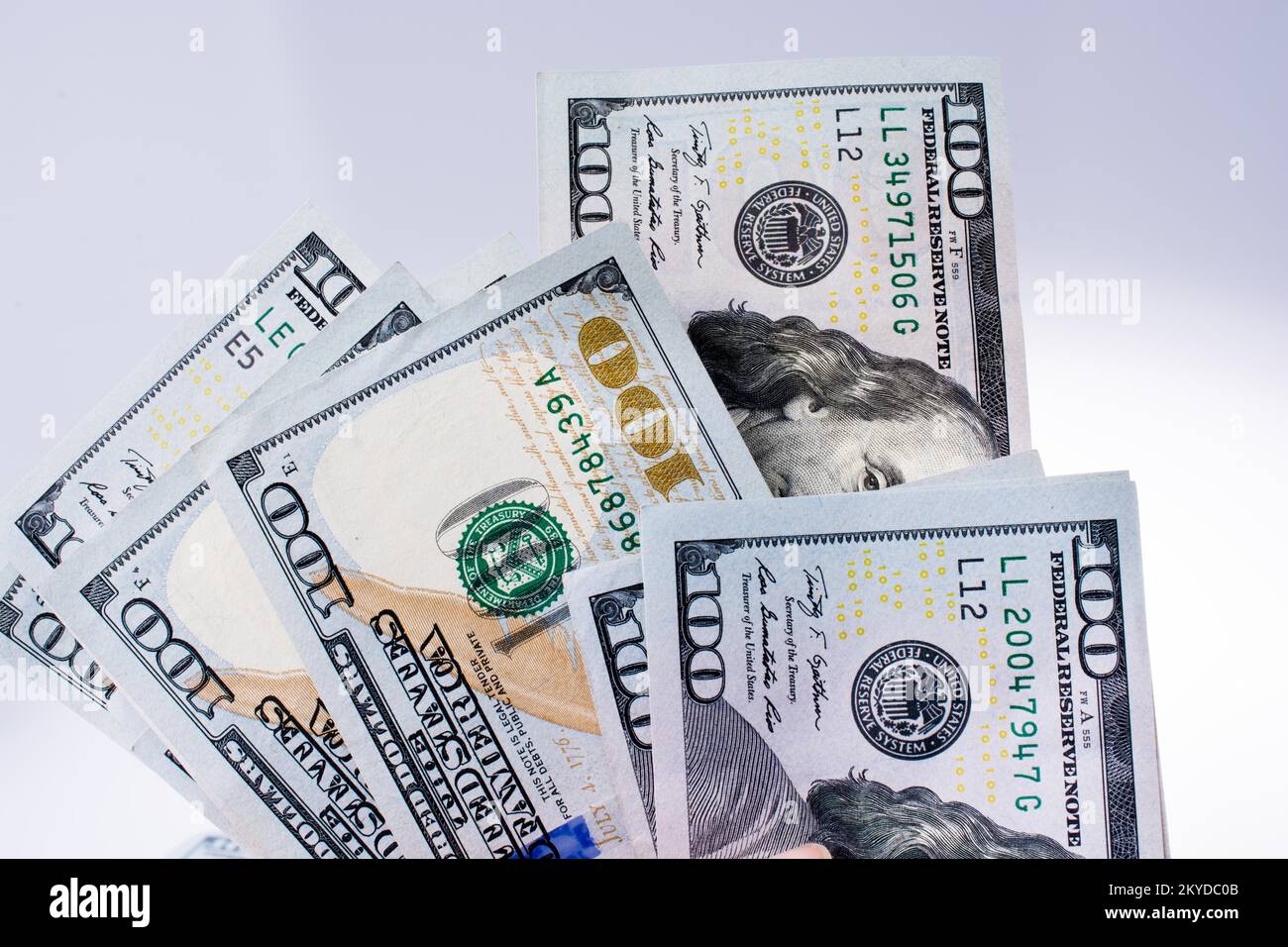 American 100 dollar banknotes made of paper placed on white background ...