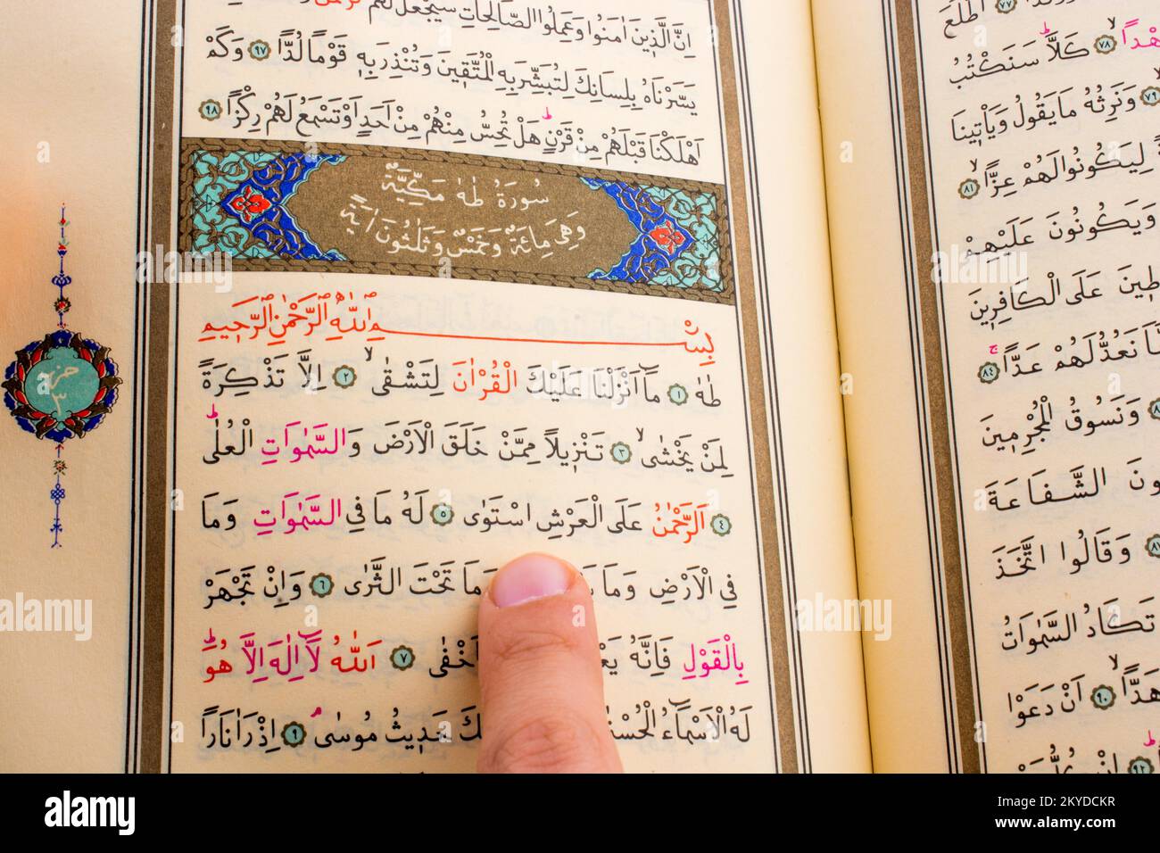Hand holding The Holy Quran on a white background Stock Photo - Alamy
