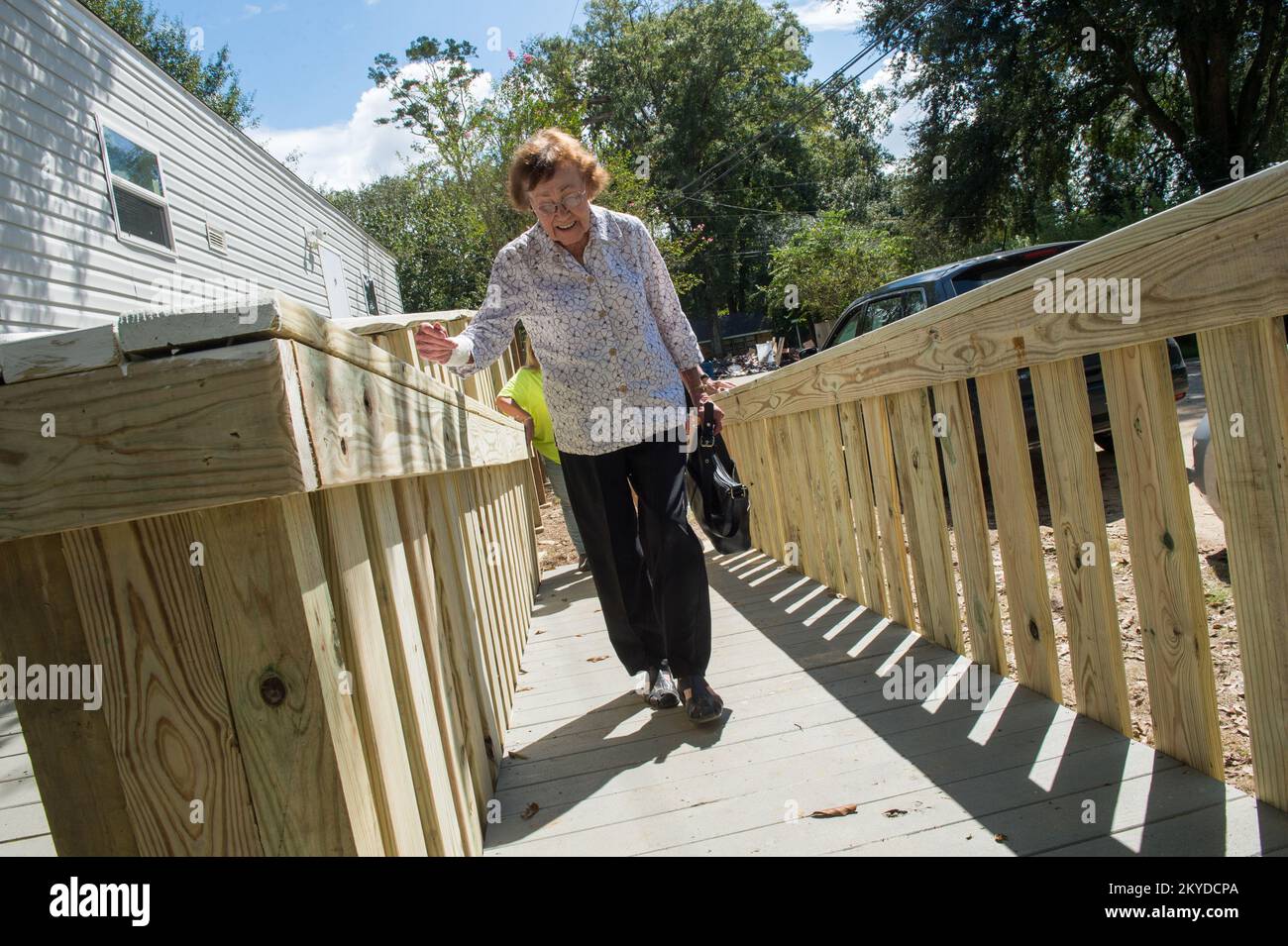 Jean Meyers, Denham Springs, La flood survivor, walks up the ramp for ...
