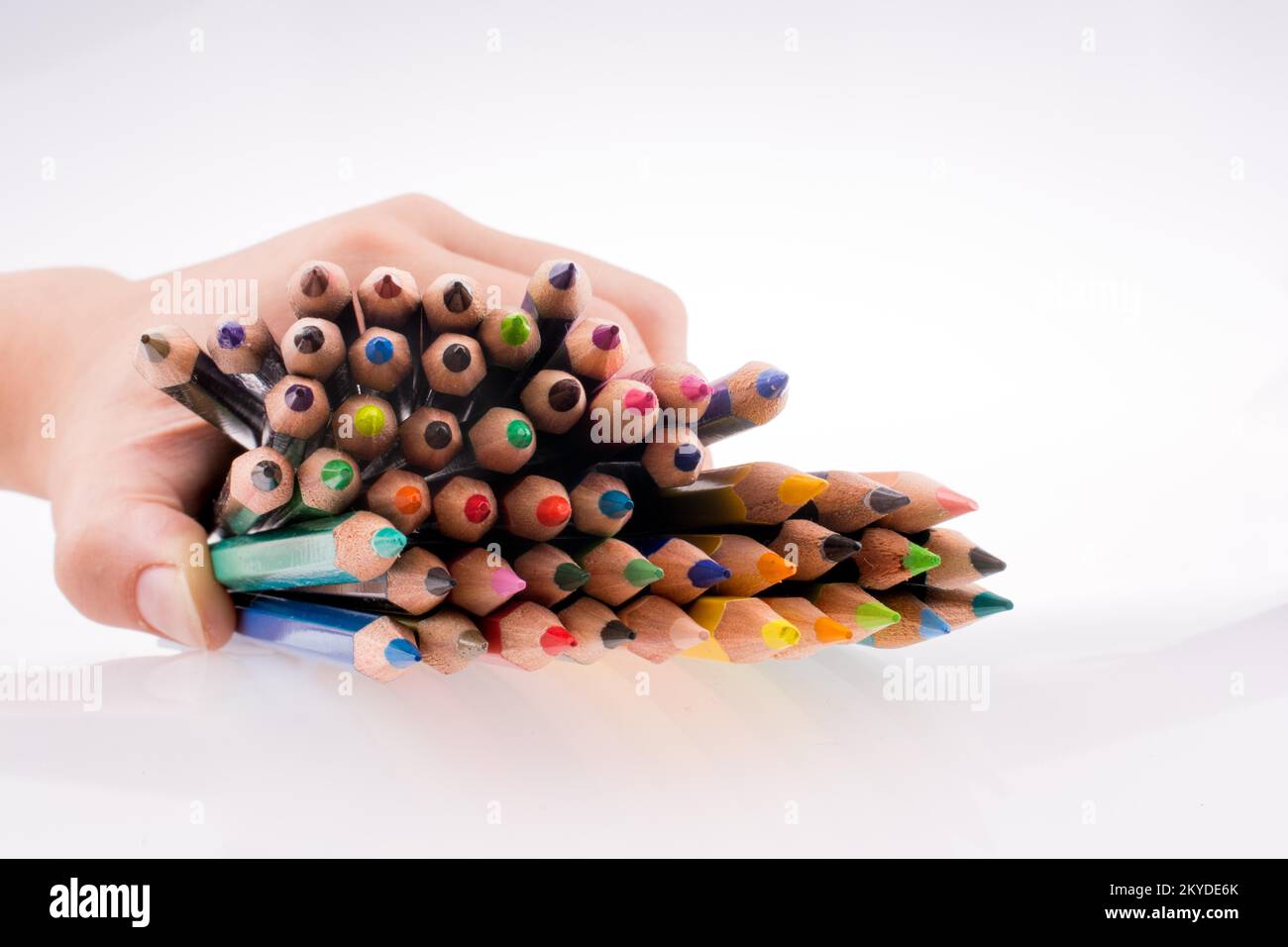 Hand holding Color pencils on a white background Stock Photo - Alamy