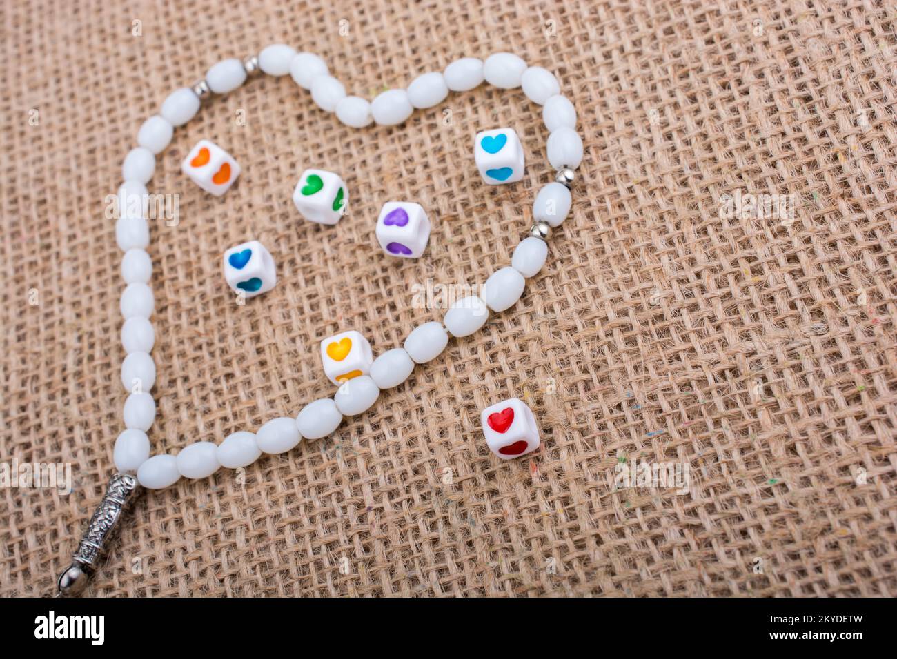 Heart shaped gold color metal object in hand Stock Photo - Alamy