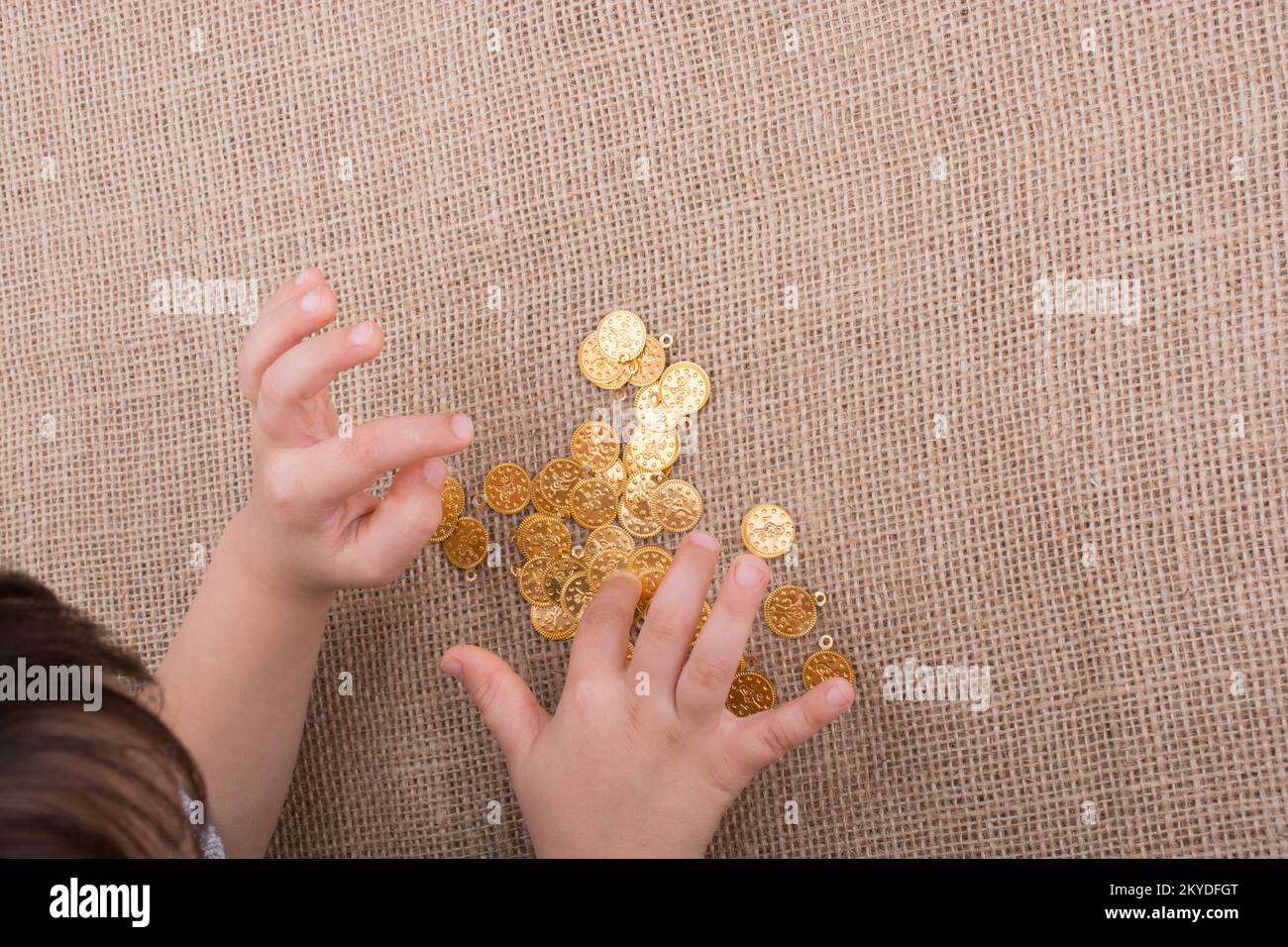 Gold coin hand hi-res stock photography and images - Alamy