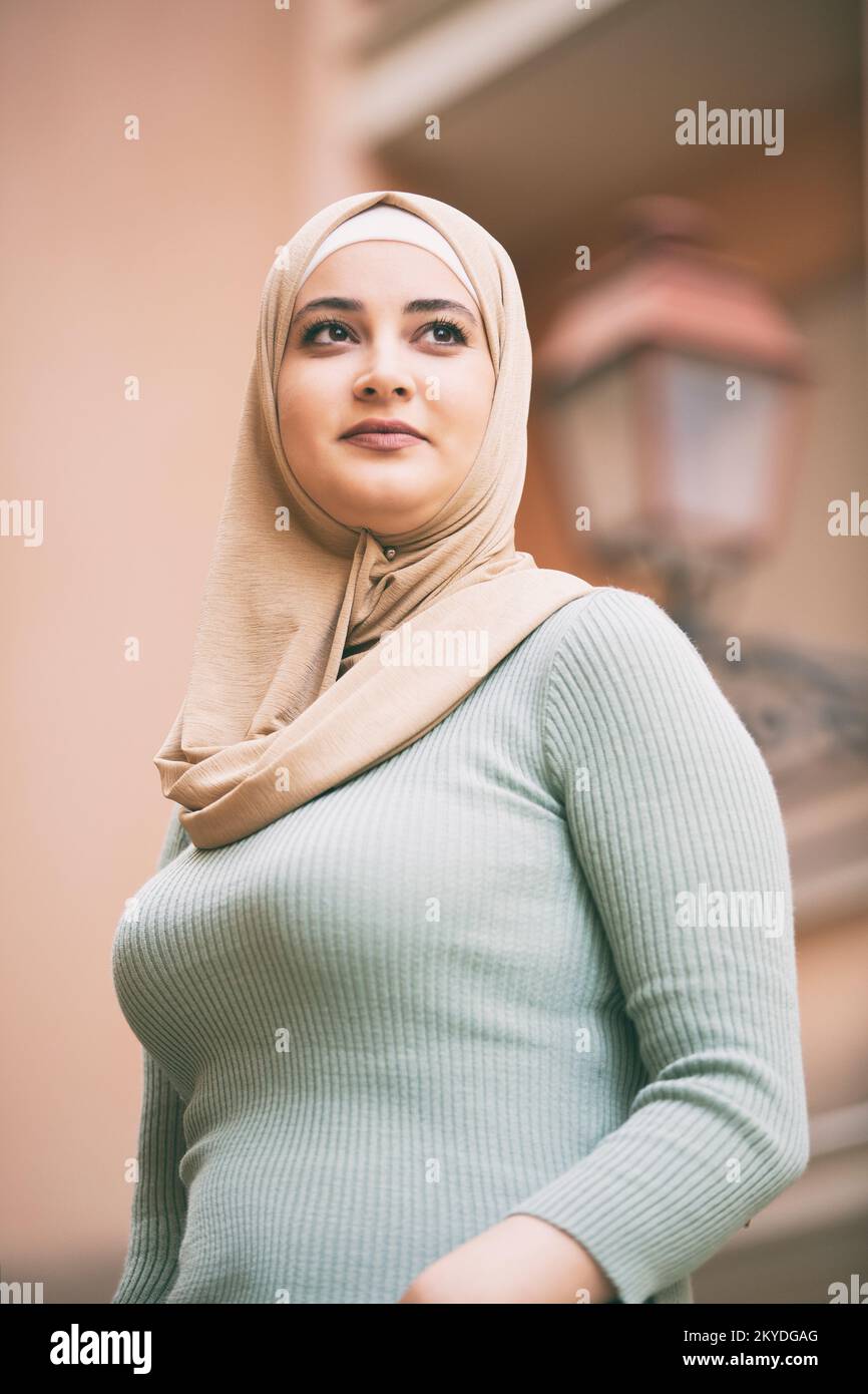 Beautiful Pensive muslim woman looking away outdoors Stock Photo - Alamy