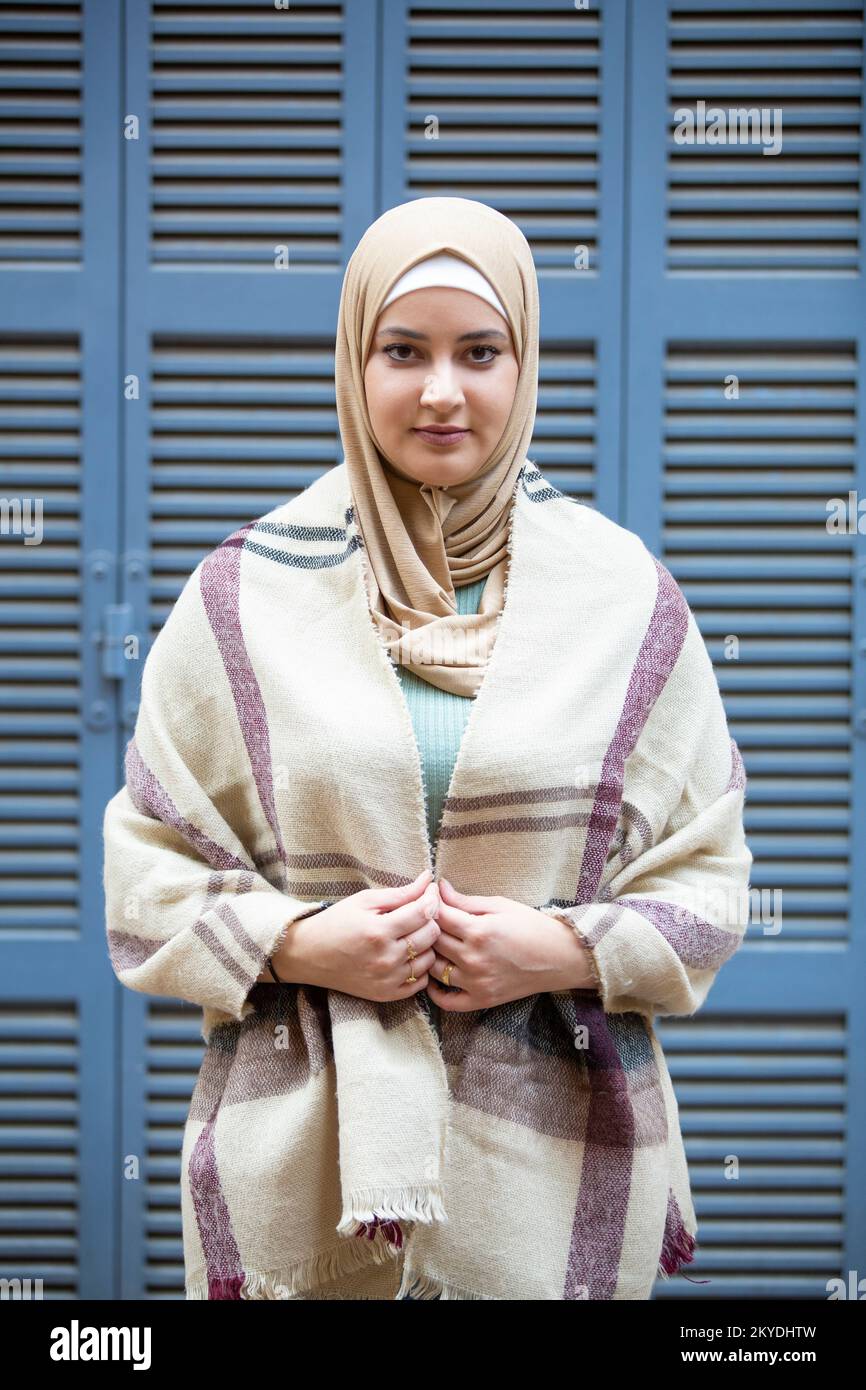 Beautiful muslim woman looking at camera outdoors Stock Photo - Alamy
