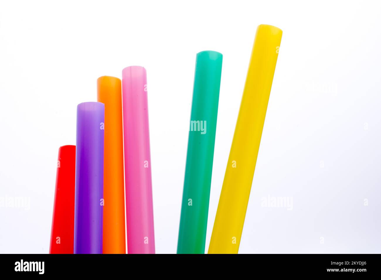 Different color of straw on a white background Stock Photo - Alamy