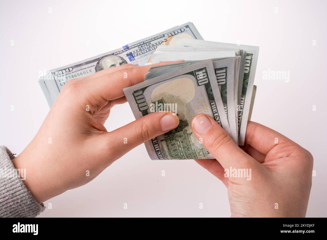 Human hand holding American dollar bill as money isolated on white ...