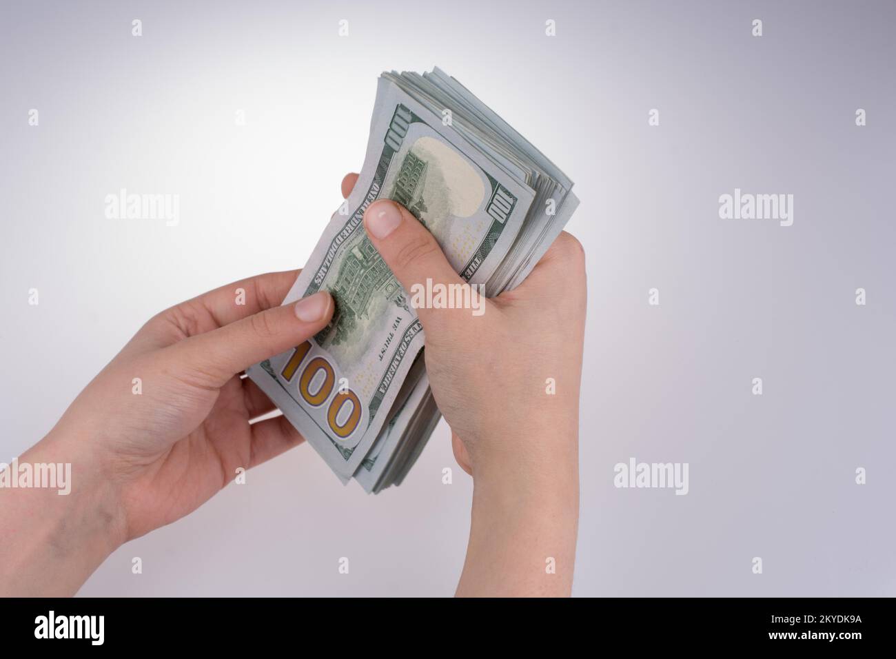 Human hand holding American dollar bill as money isolated on white ...