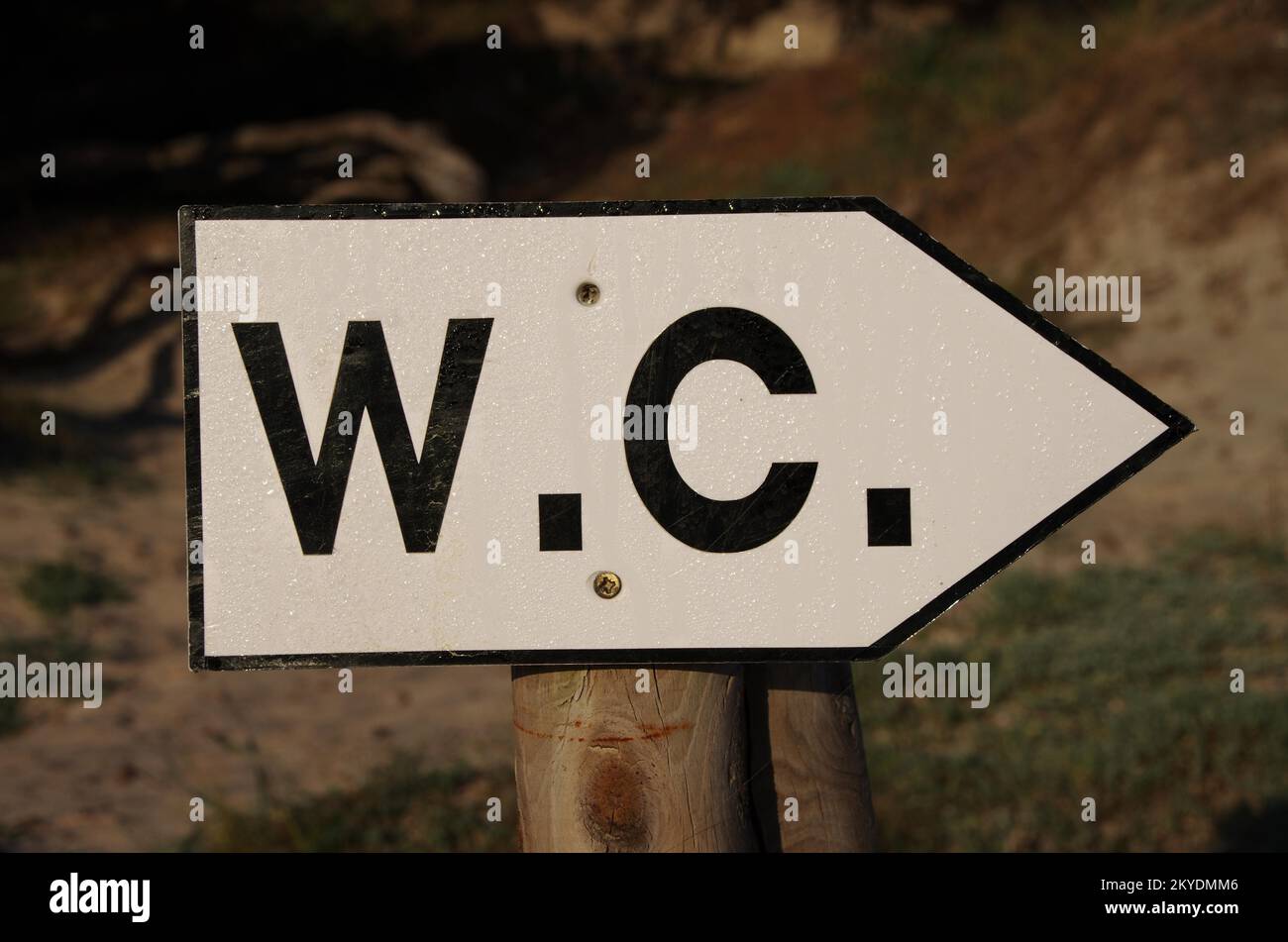 Sign, wooden sign, inscription, W.C., direction, arrow, a sign with the ...