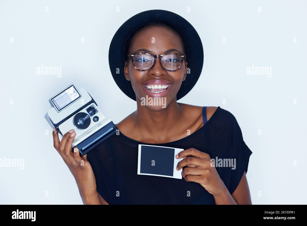 Fun with vintage cameras. A young woman taking a photograph of you ...