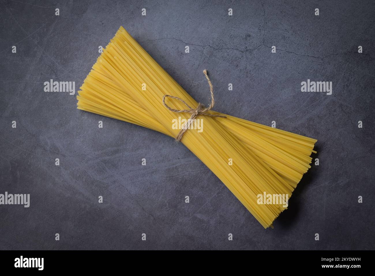 Raw spaghetti pasta uncooked, spaghetti noodles on dark background, raw ...