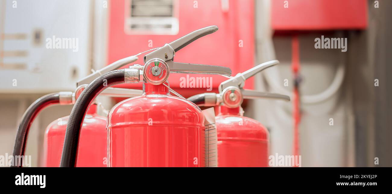 The red fire extinguisher is ready for use in case of an indoor fire ...